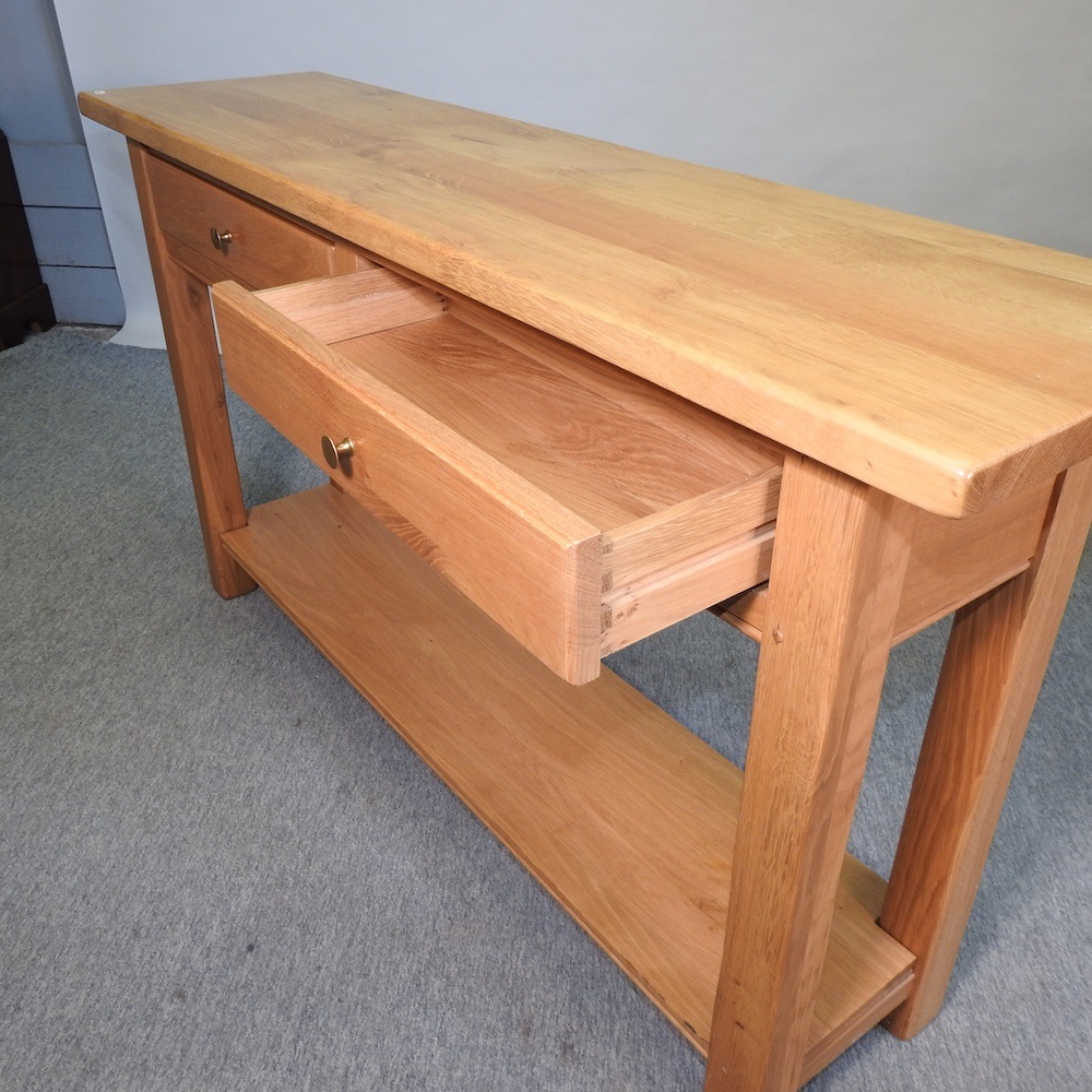 Lot 455 - A modern light oak console table