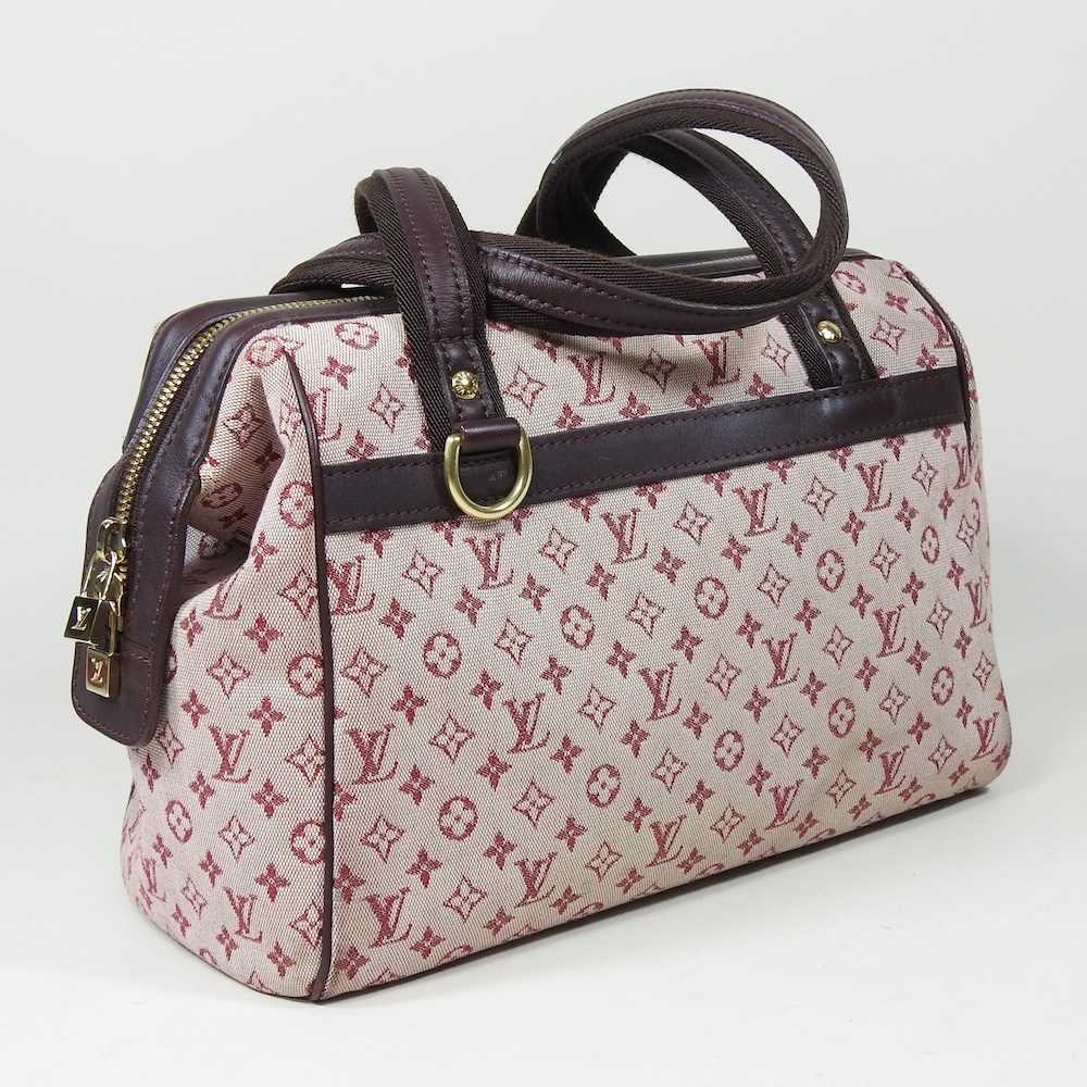 Lot 74 - A Louis Vuitton Mini Lin handbag, in burgundy