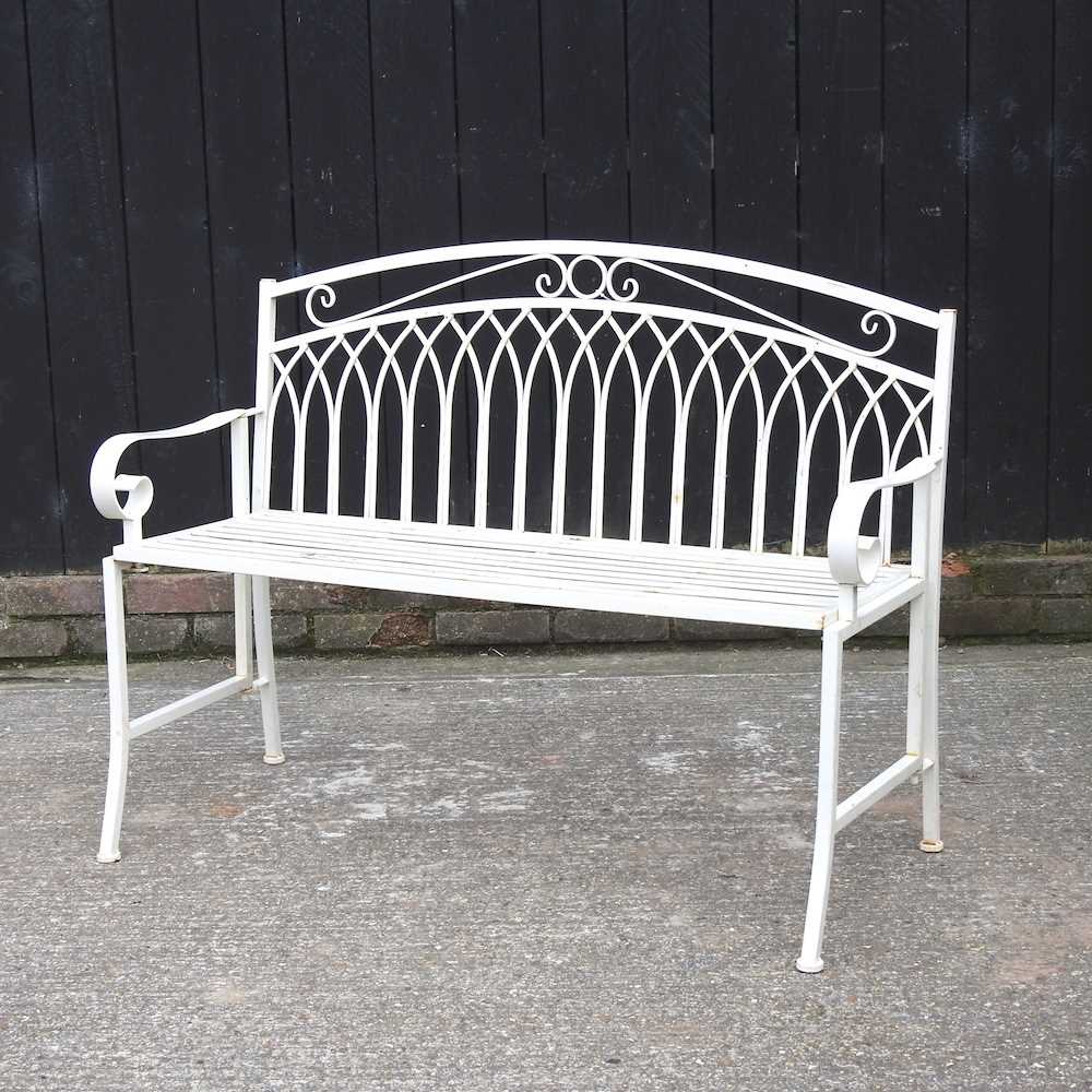 Lot 197 - A white painted metal garden bench