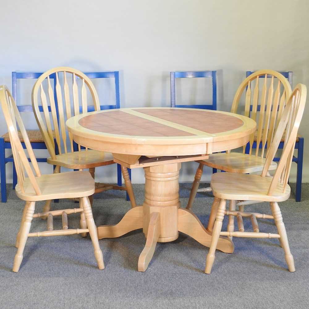 Lot 461 - A tile top beech extending dining table