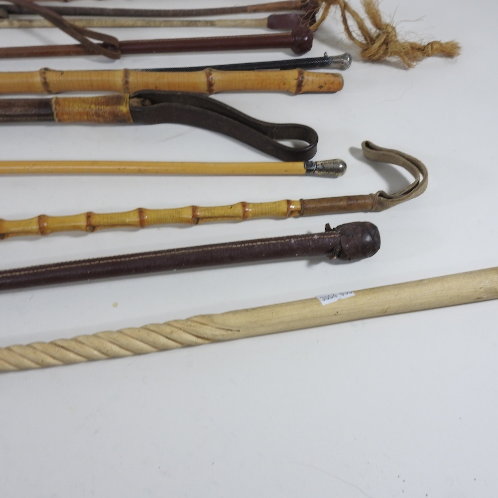 Lot 286 - A collection of riding crops and horse whips