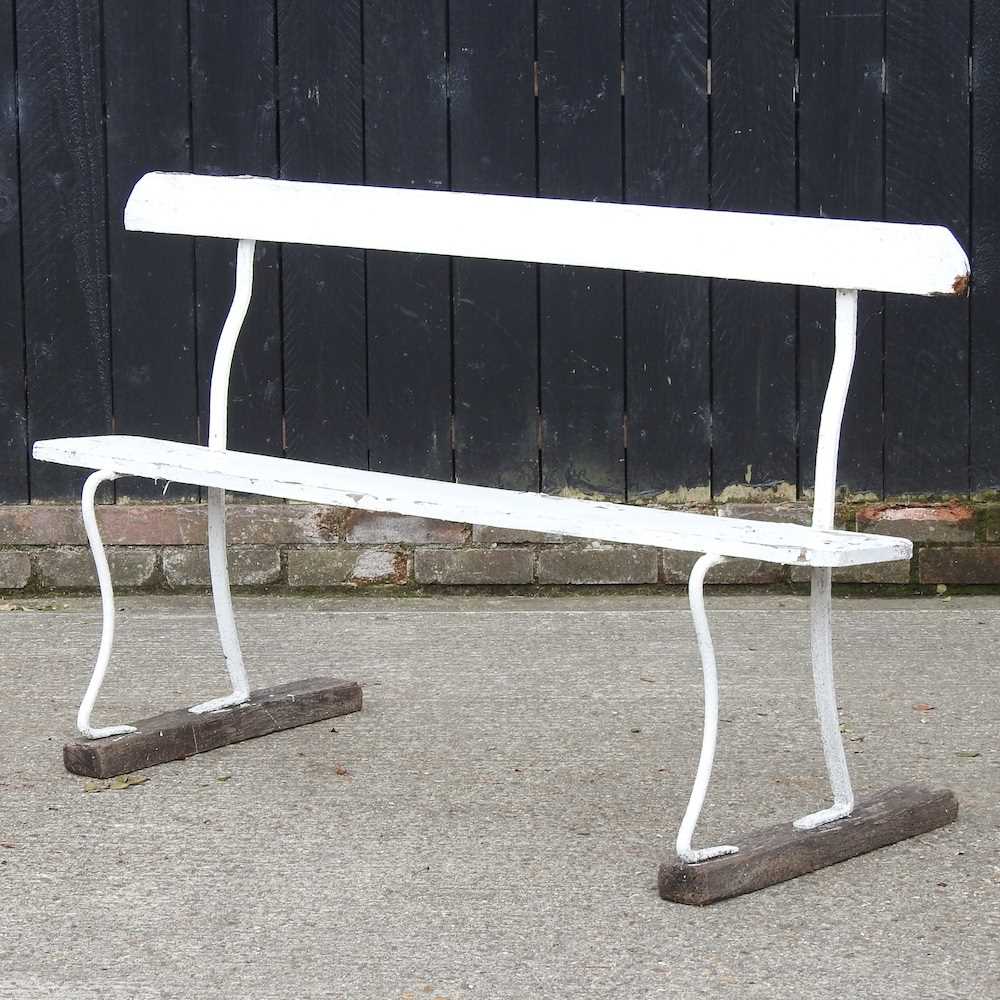 Lot 197 - A white painted garden bench, on metal