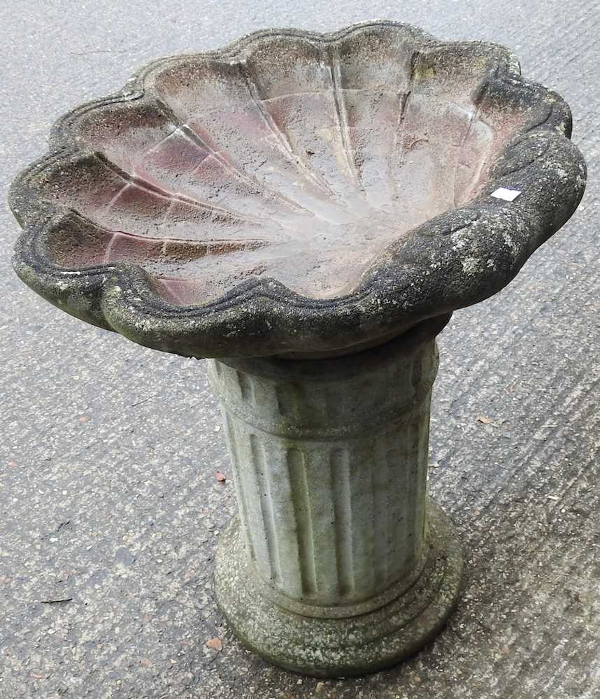 Lot 158 - A cast stone bird bath, 64cm high