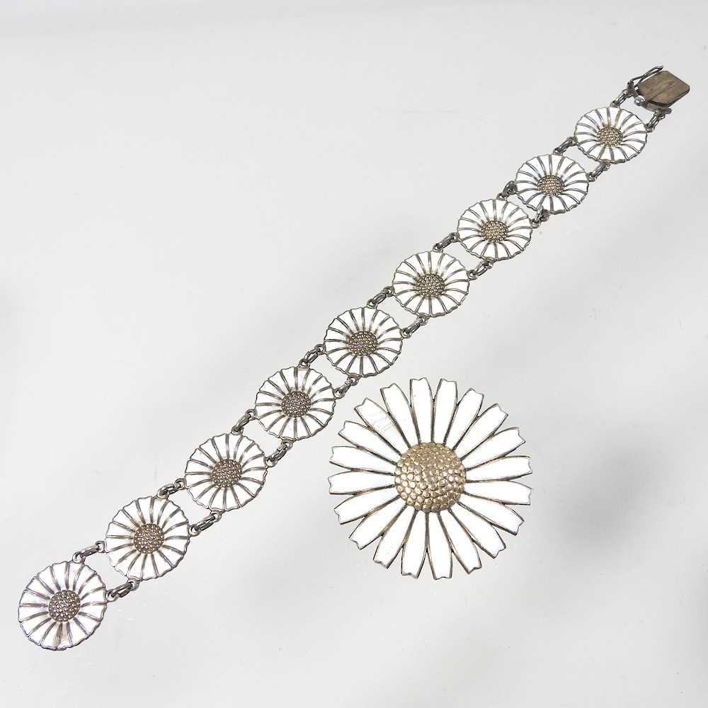 Lot 204 - A Georg Jensen silver and enamel daisy