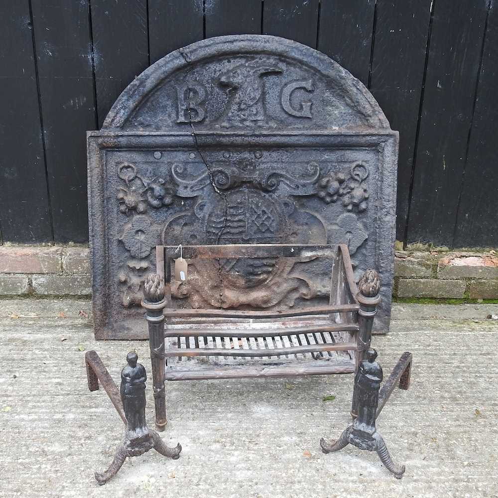 Lot 123 - A large cast iron fire back, of arched shape,