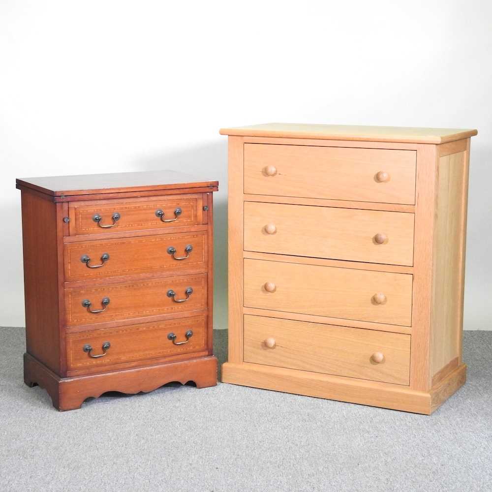 Lot 425 - A modern light oak chest of drawers,