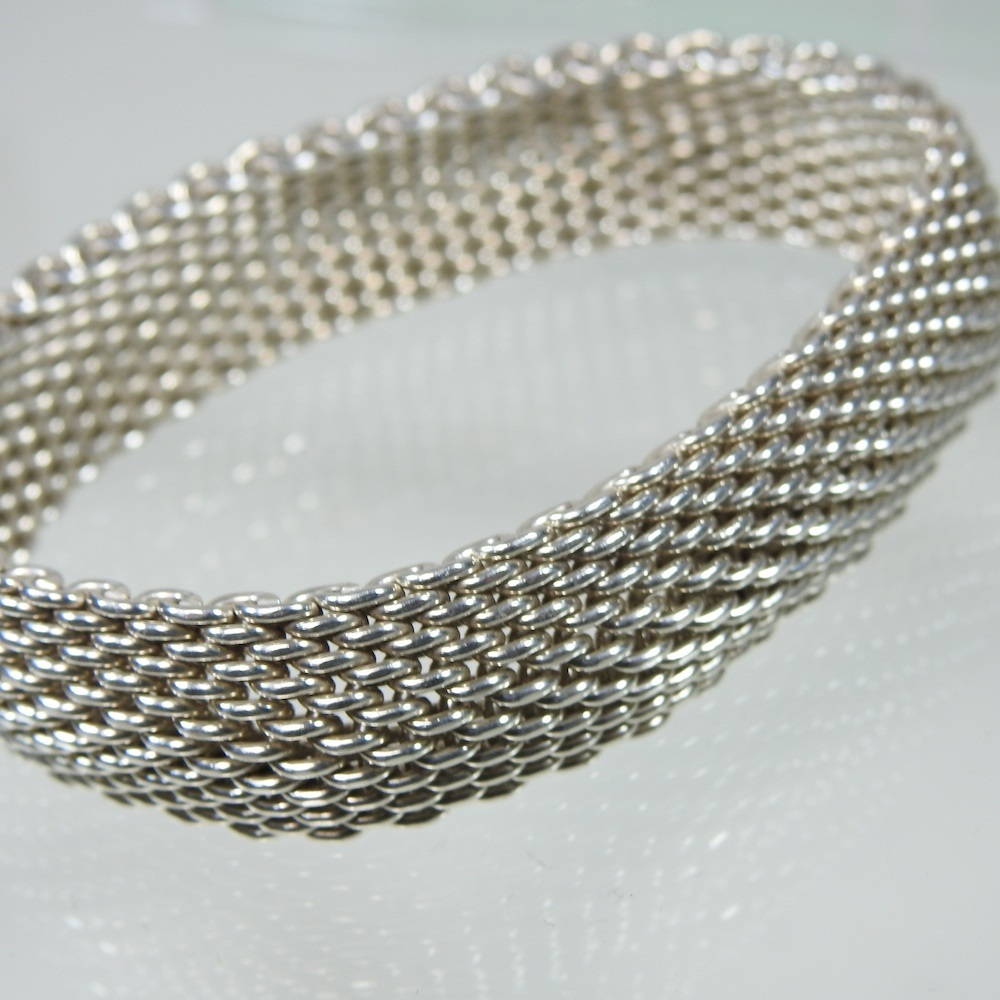 Lot 235 - A Tiffany & Co. silver mesh bracelet,