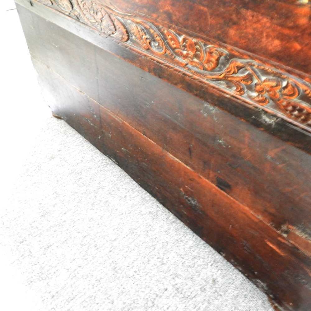 Lot 222 - An 18th century carved oak sword chest, with