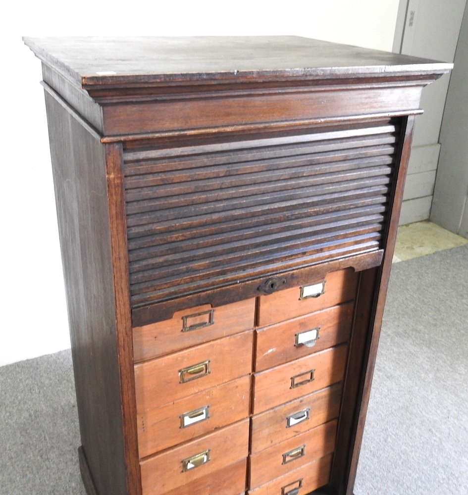 Lot 369 - An early 20th century tambour front filing