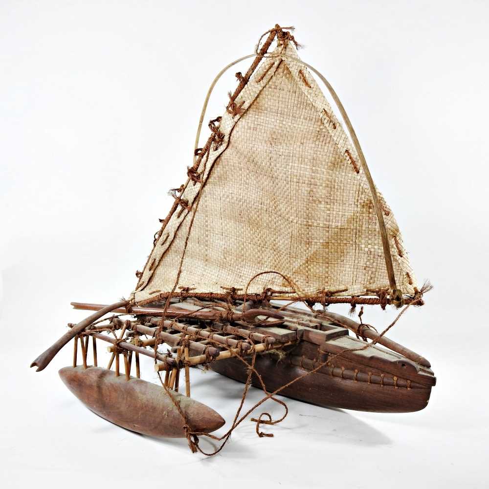 Lot 137 - A carved wooden model of a Samoa canoe with