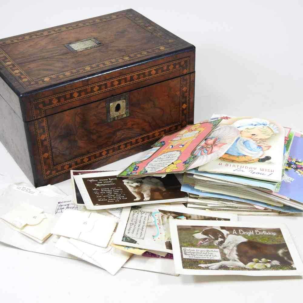 Lot 482 - A Victorian inlaid box, containing postcards