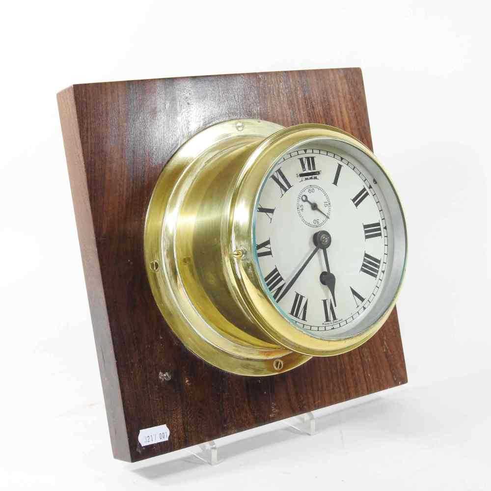 Lot 355 - A brass cased ship's bulkhead clock, with a