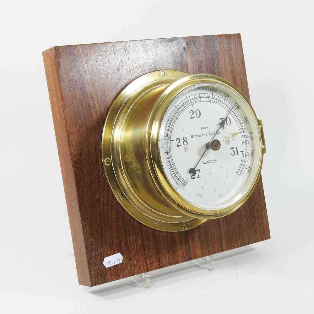 Lot 2 - A brass cased ship's barometer, the six inch