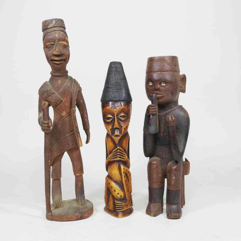 Lot 56 - An African carved bone tribal statue, of a