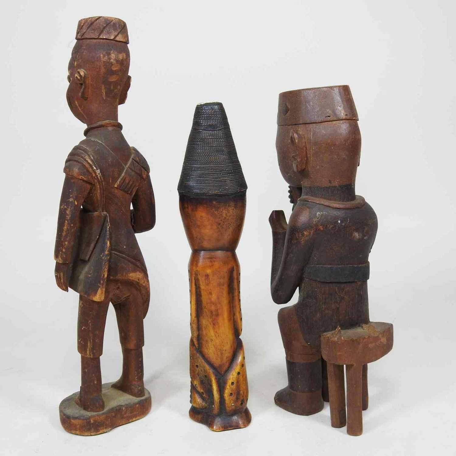 Lot 56 - An African carved bone tribal statue, of a