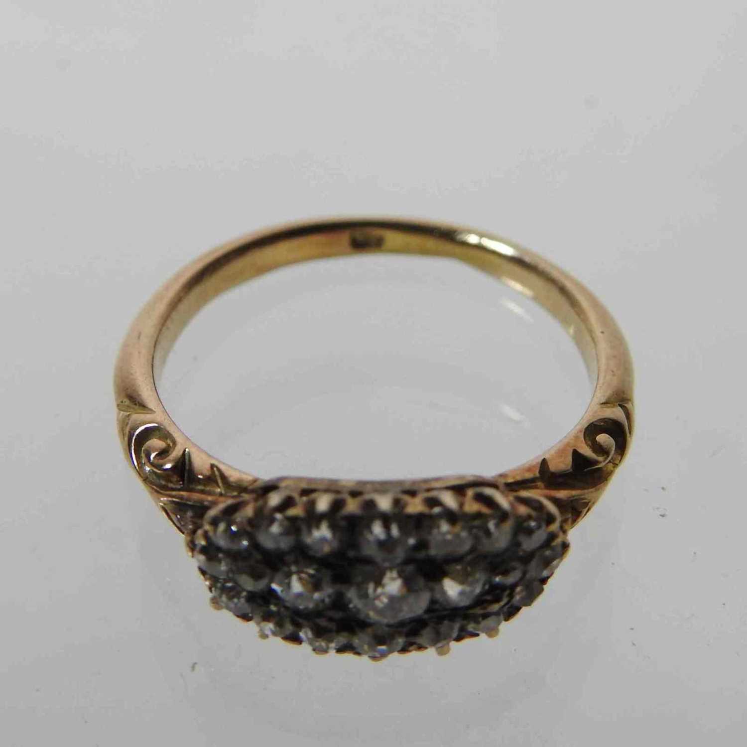 Lot 303 - A diamond cluster ring, of elliptical shape,