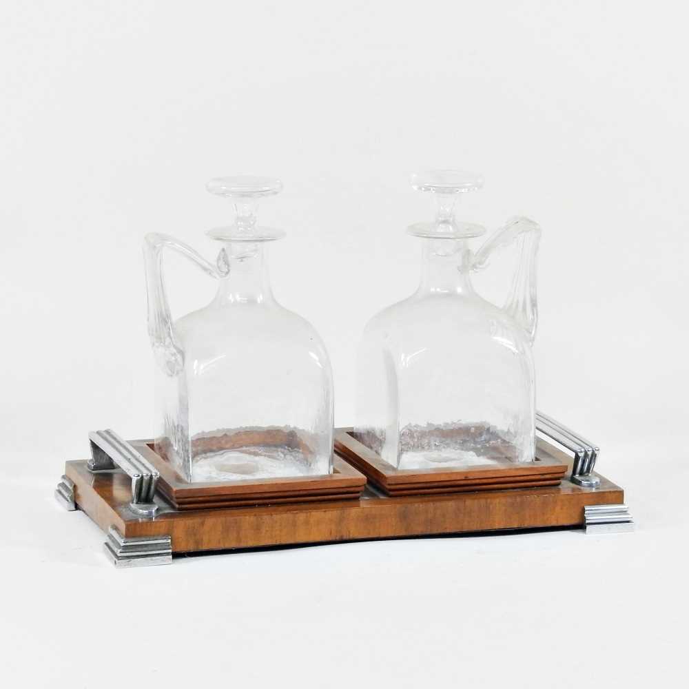 Lot 286 - An Art Deco walnut and chrome decanter stand,
