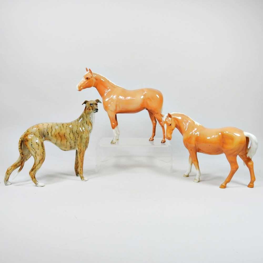 Lot 74 - Two Beswick palomino horses, together with a
