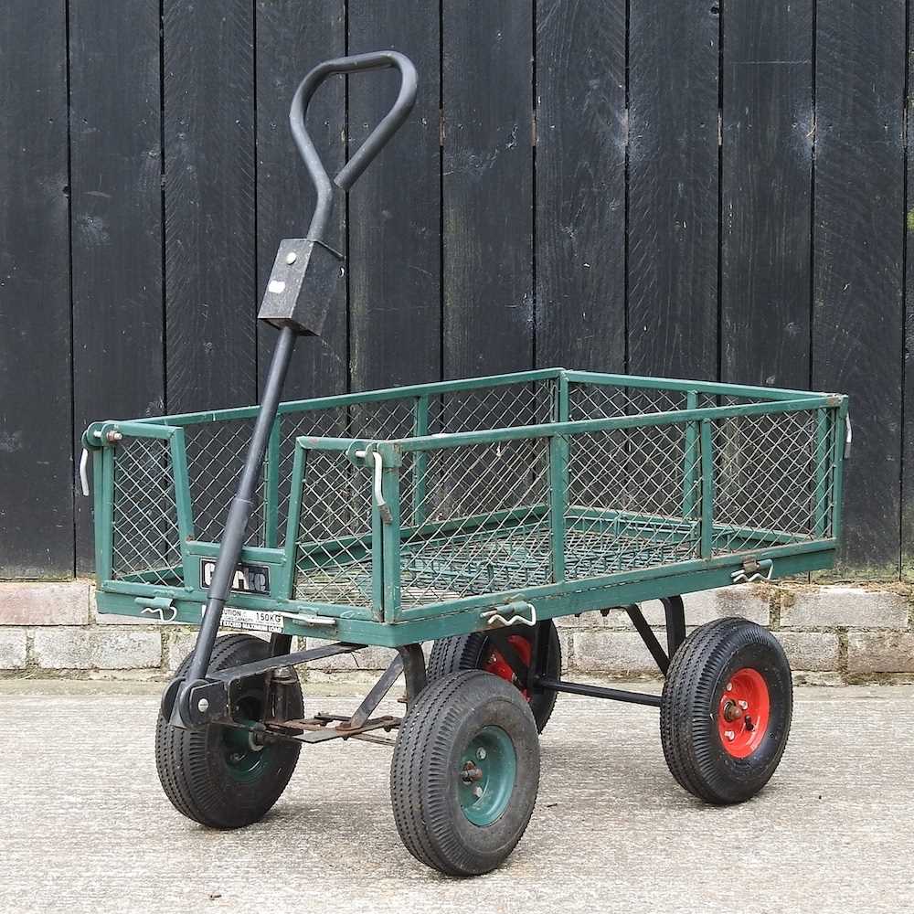 Lot 328 - A green painted metal garden trolley