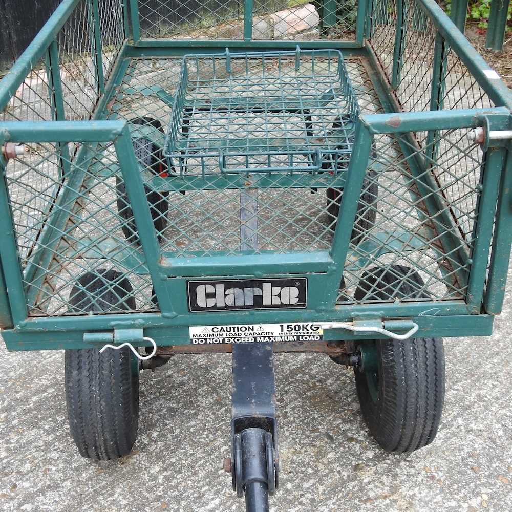 Lot 328 - A green painted metal garden trolley