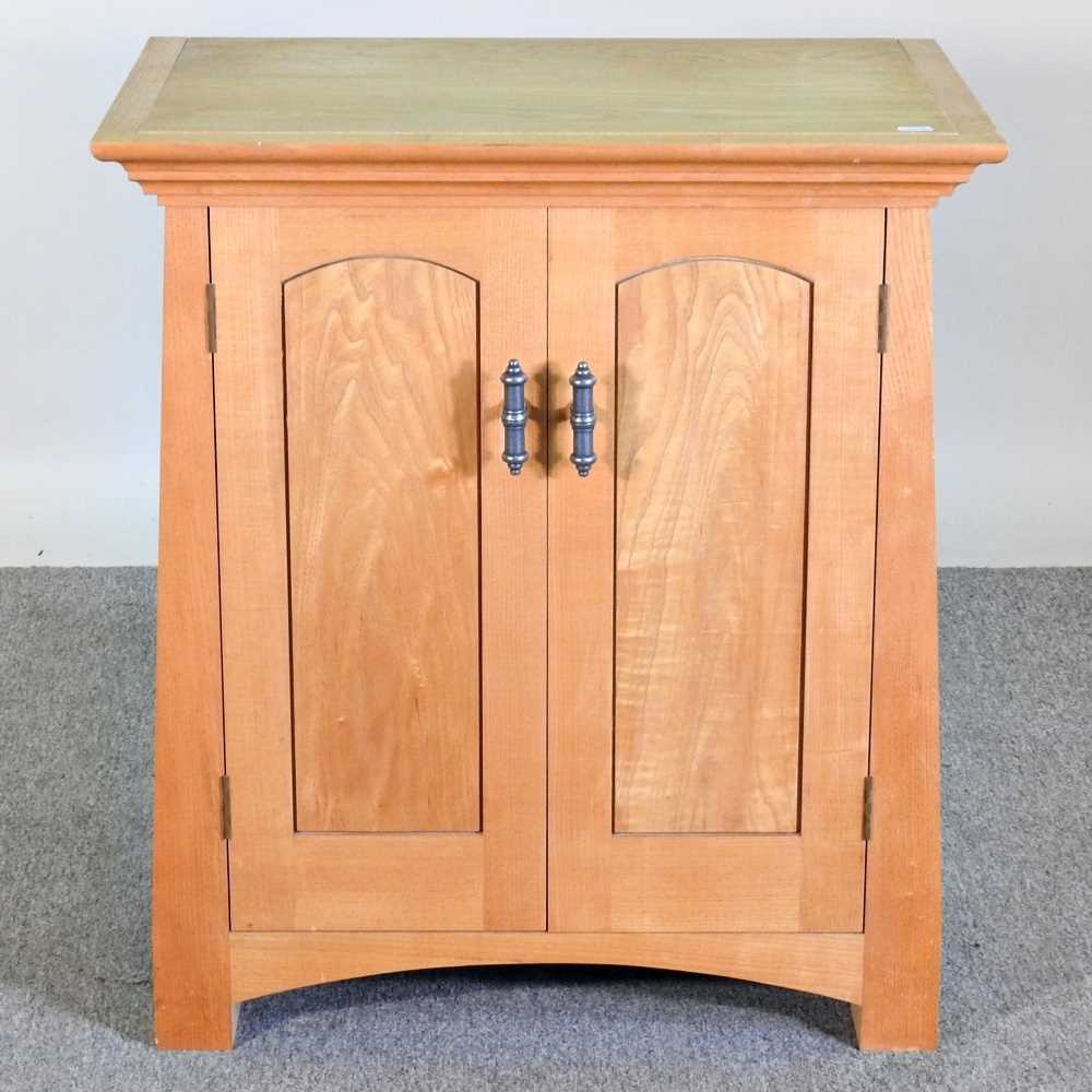 Lot 126 - A modern light oak cabinet, containing four