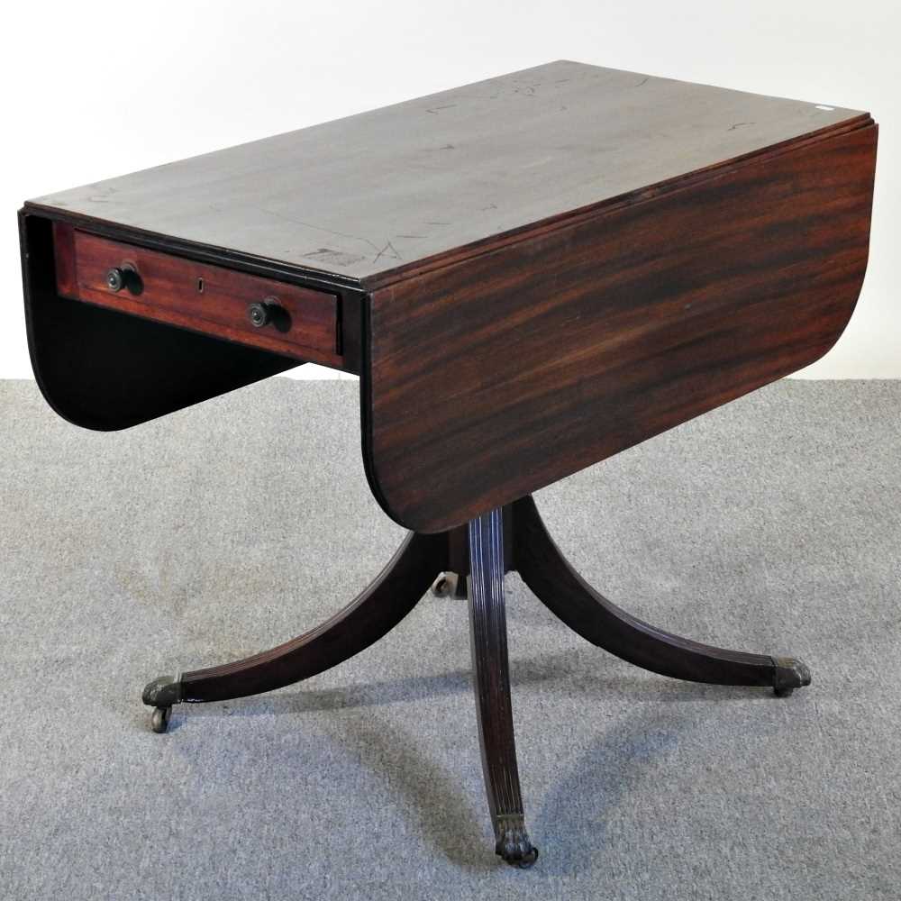 Lot 291 - A Regency mahogany drop leaf dining table,