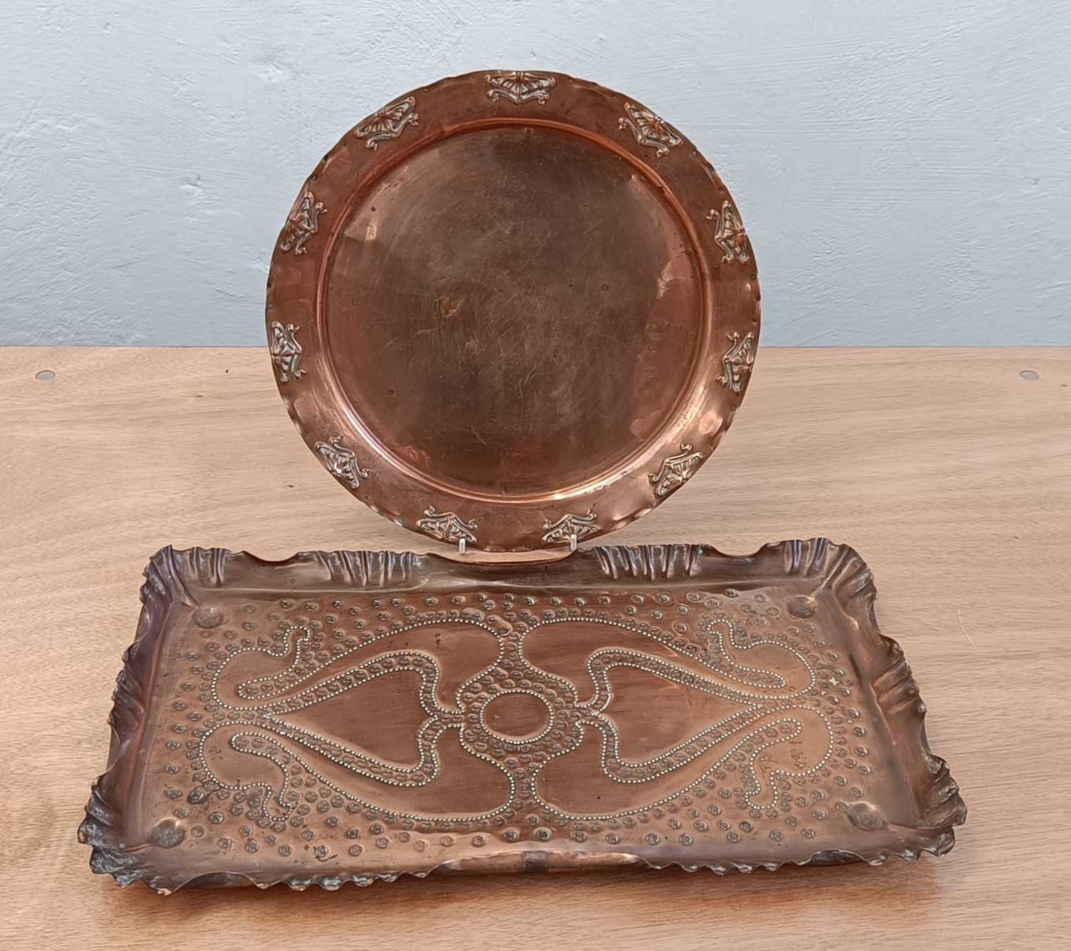 Lot 282 - A Newlyn type repousse decorated copper tray,