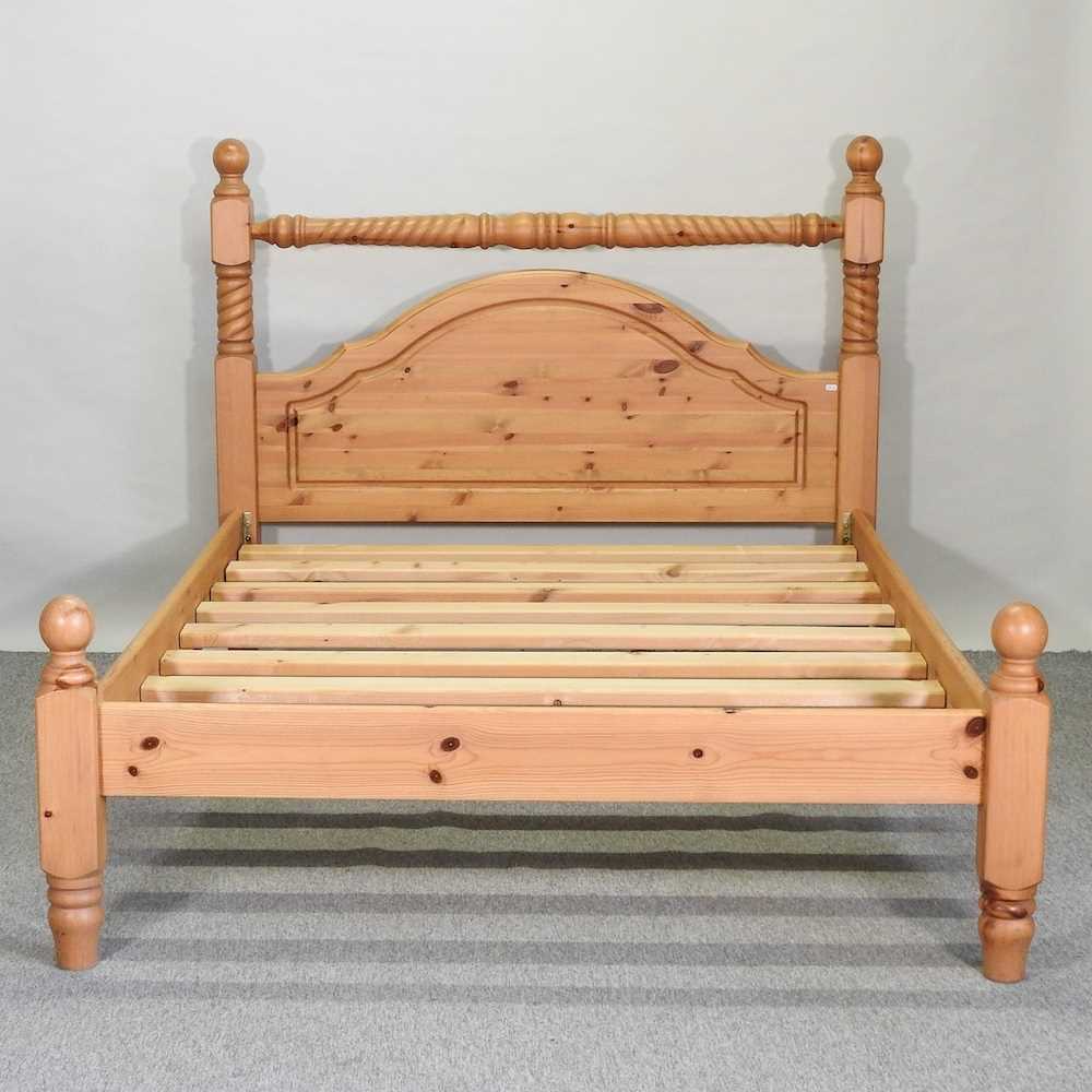 Lot 425 - A modern pine double bedstead