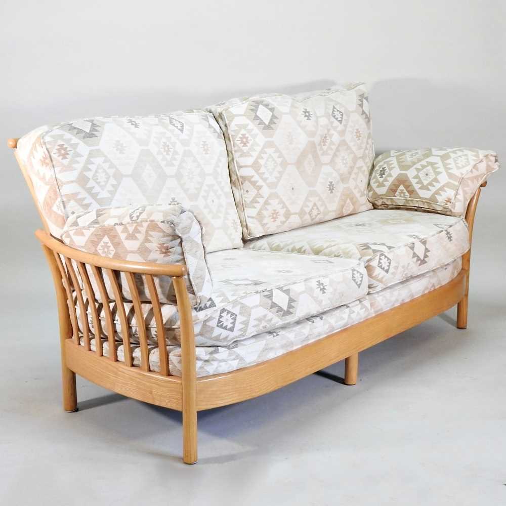 Lot 249 - An Ercol light elm Renaissance sofa, with