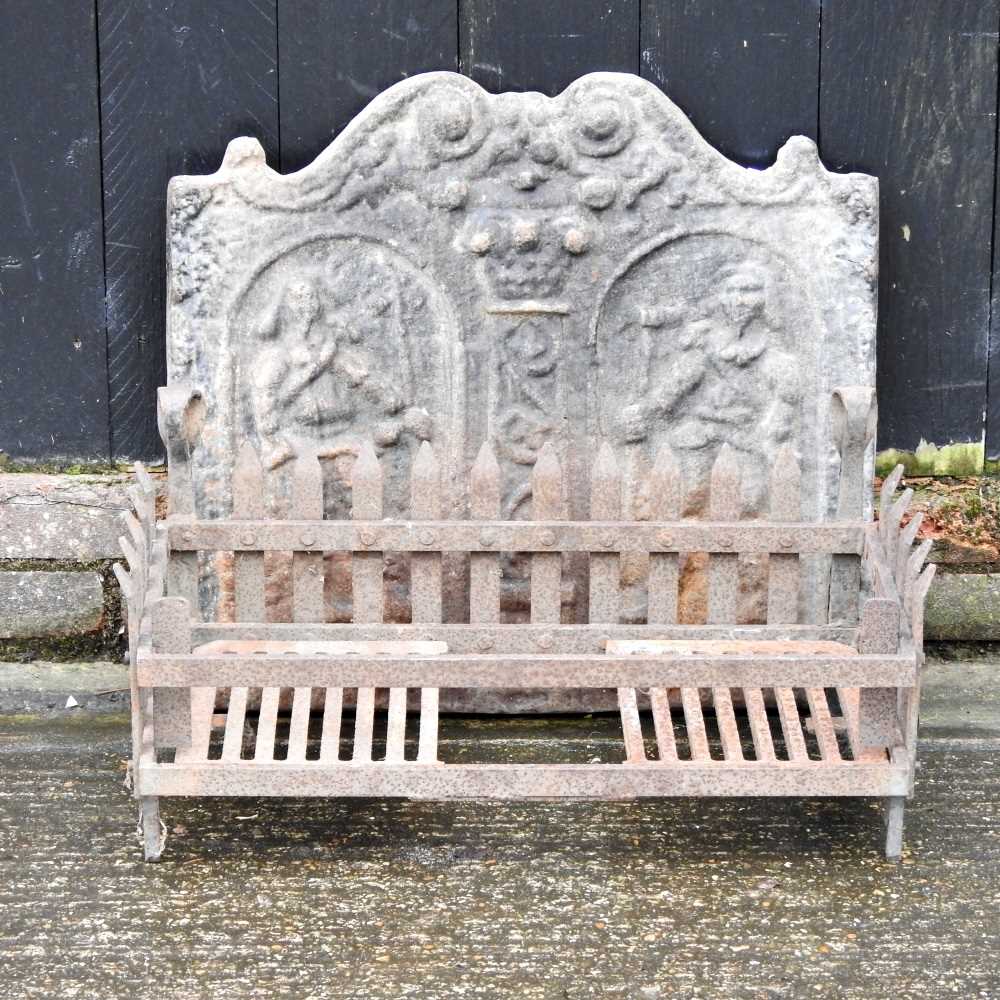 Lot 167 - A cast iron fire back, 57cm high, decorated