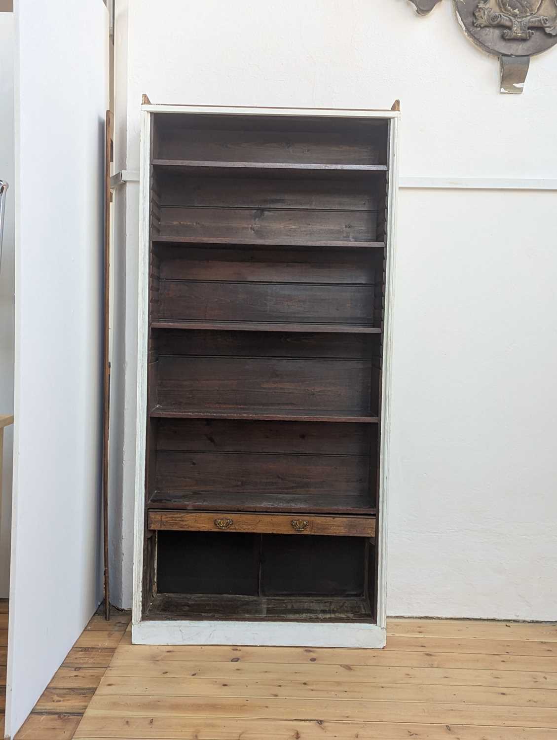 Lot 569 - A white painted standing open bookcase, with