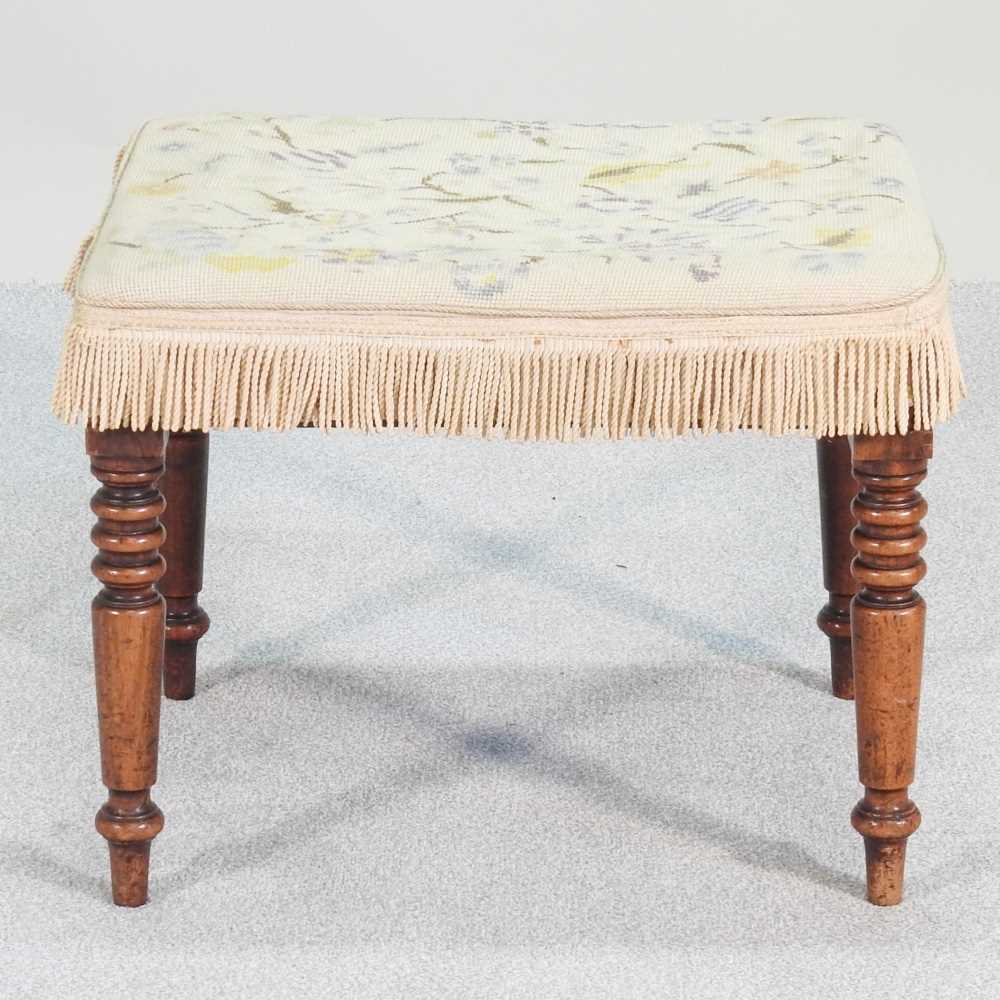 Lot 643 - A Victorian upholstered footstool, on turned