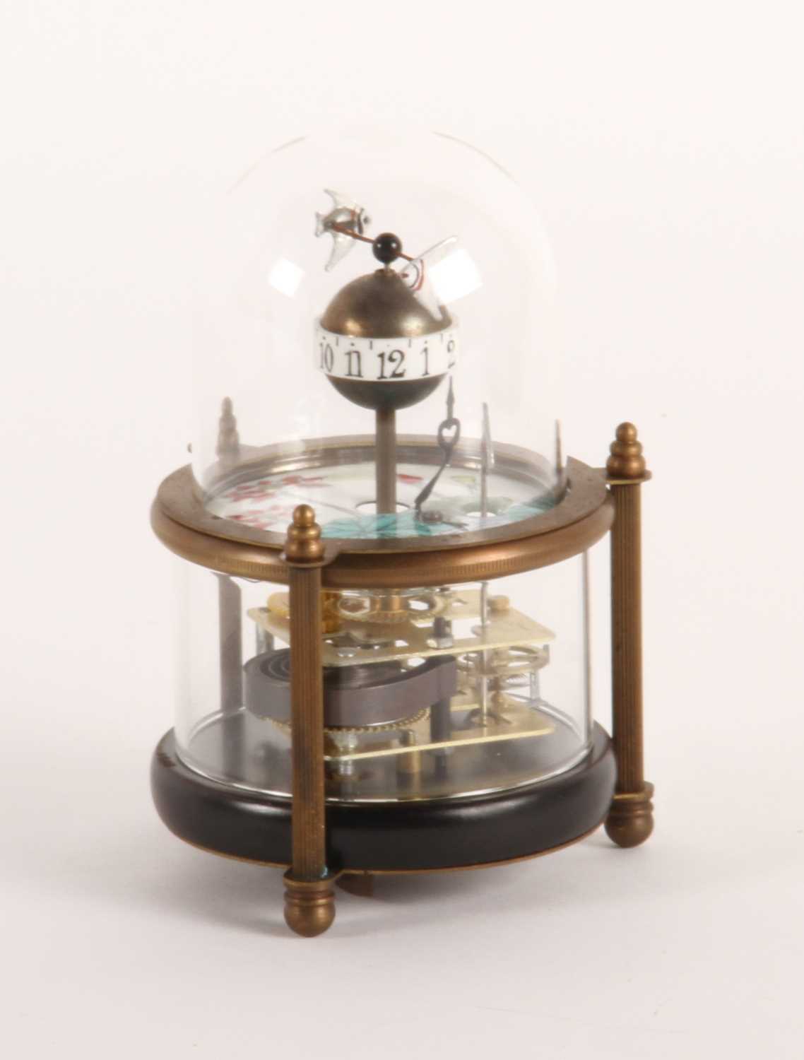 Lot 379 - A clockwork automaton clock, decorated with