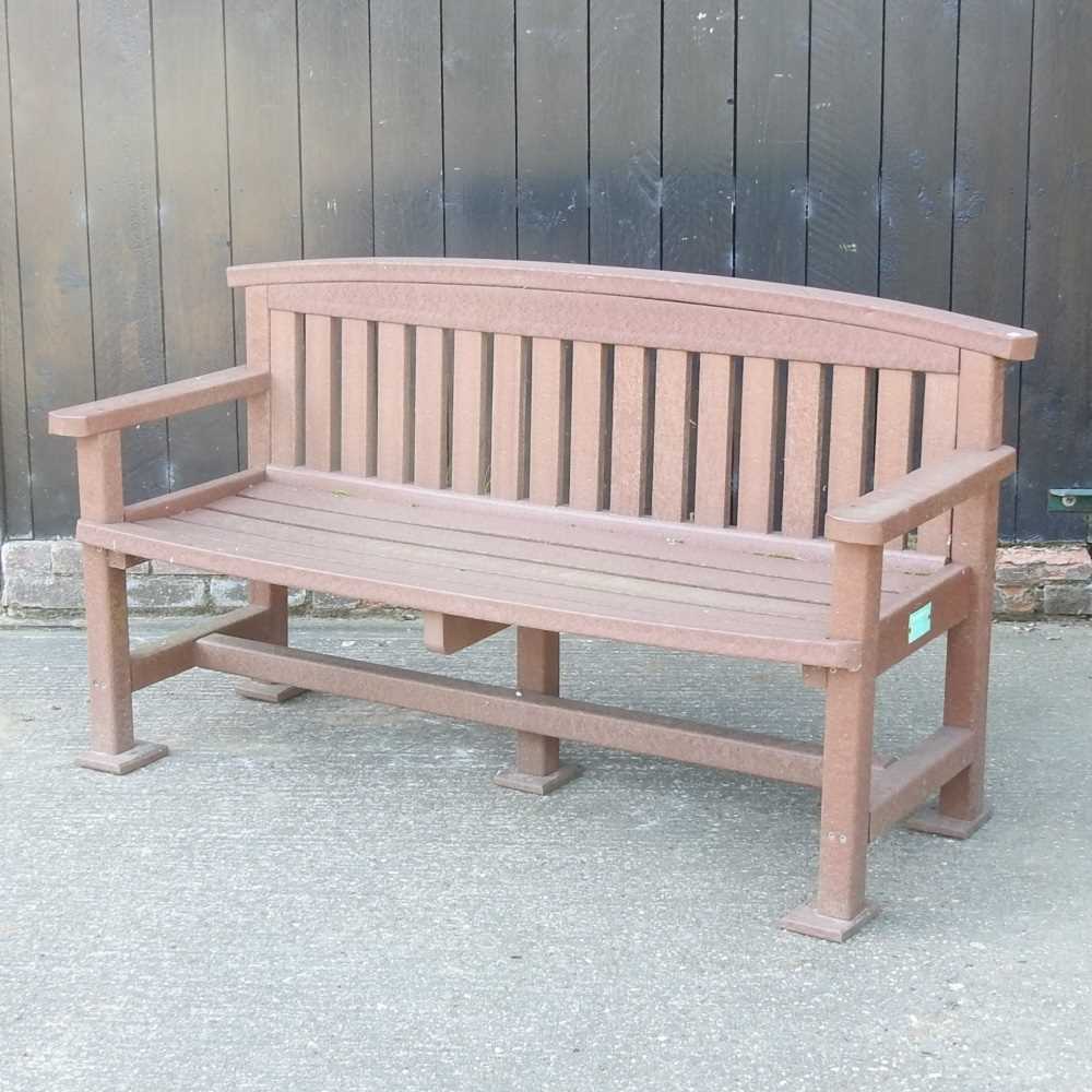 Lot 135 - A composite wood effect garden bench