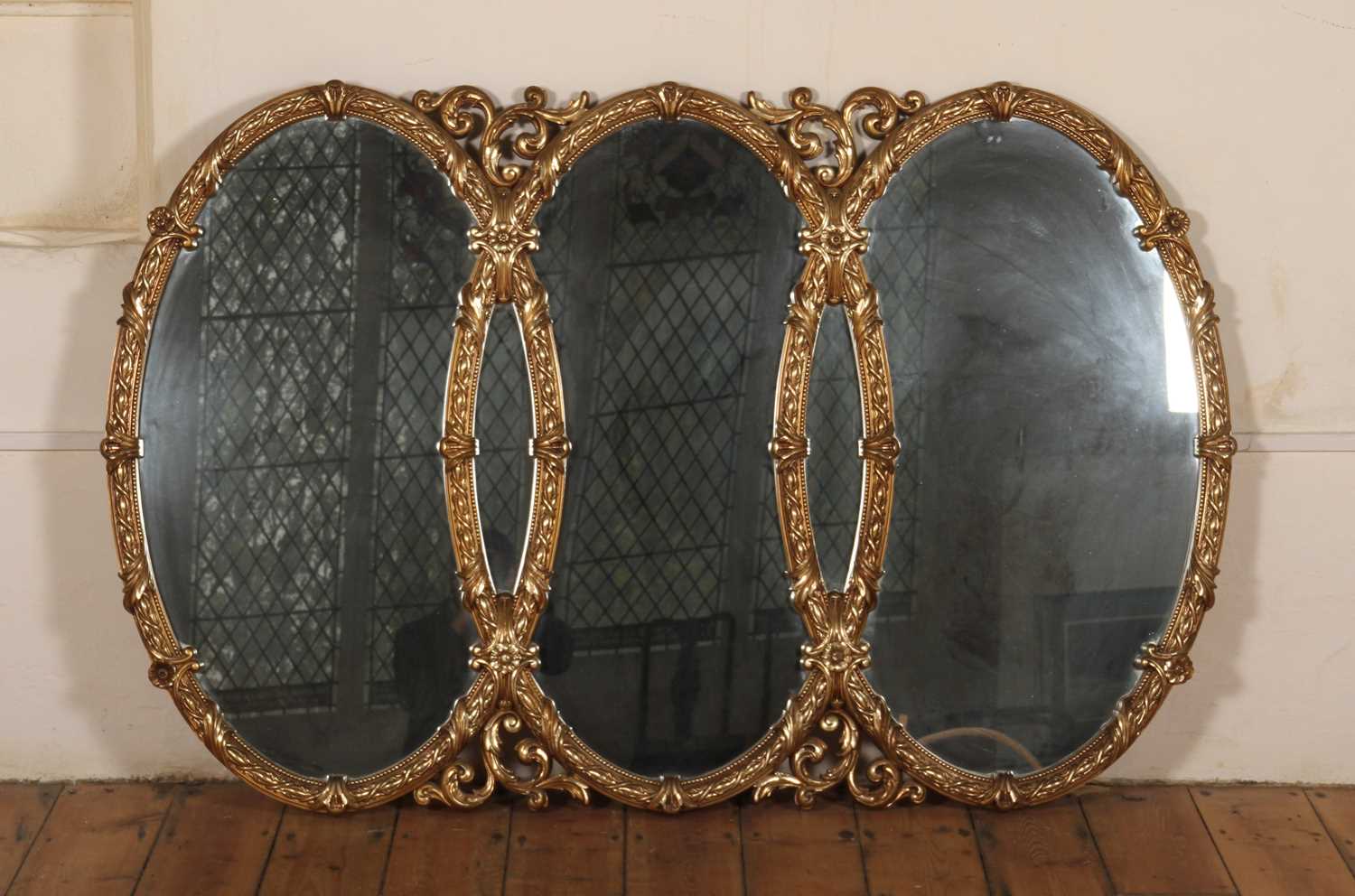 Lot 535 - A gilt framed triple oval mirror