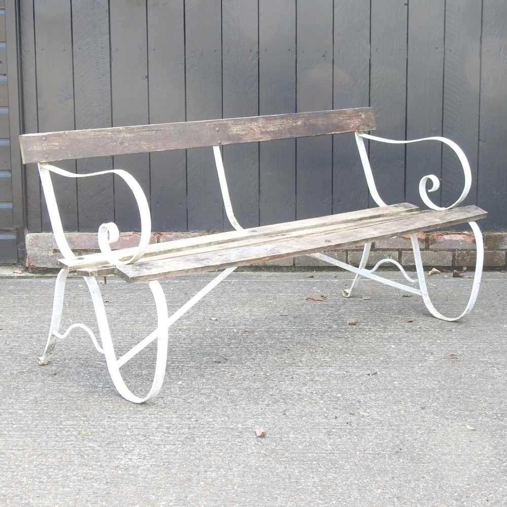 Lot 145 - A wooden garden bench, on white painted iron