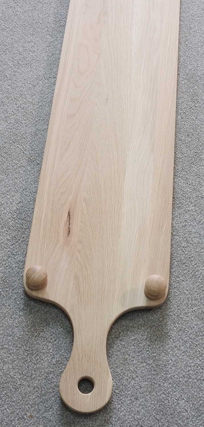 Lot 191 - A large handmade wooden platter, 150cm long