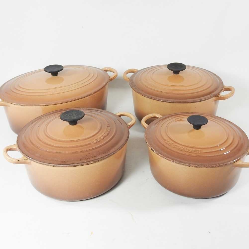 Lot 681 - A set of four Le Creuset cast iron pans, of