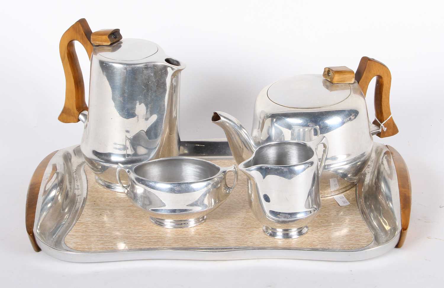Lot 297 - A 1970s Picquot ware metal five piece tea