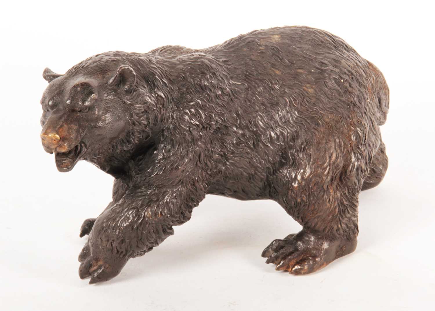 Lot 81 - A bronze model of a bear, shown prowling