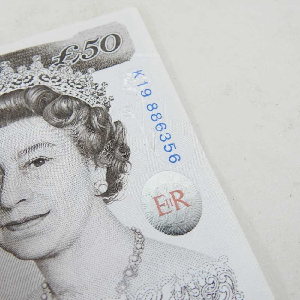 Lot 151 - A set of three old £50 bank notes, with