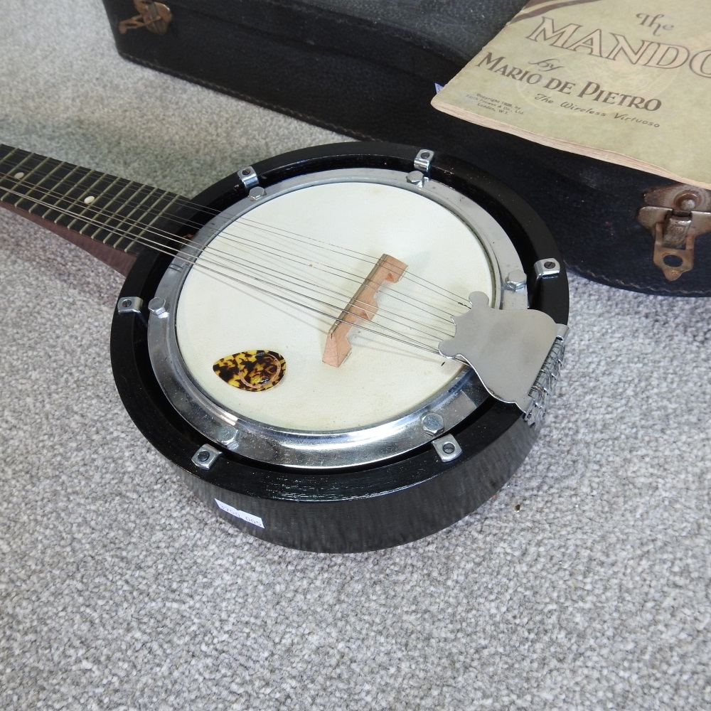 Lot 245 - A Bristish Made eight string banjo mandolin,