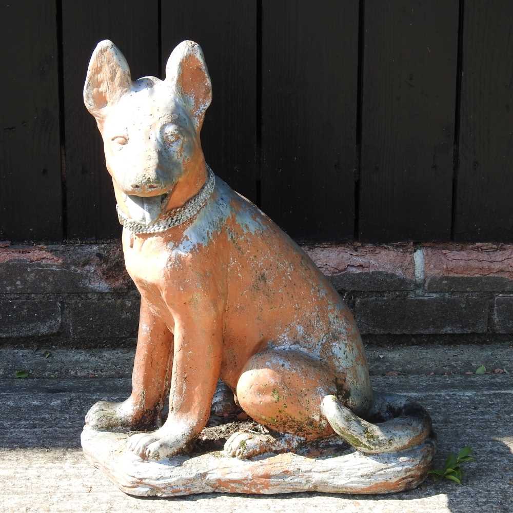 Lot 546 - A cast stone garden statue of an alsatian,