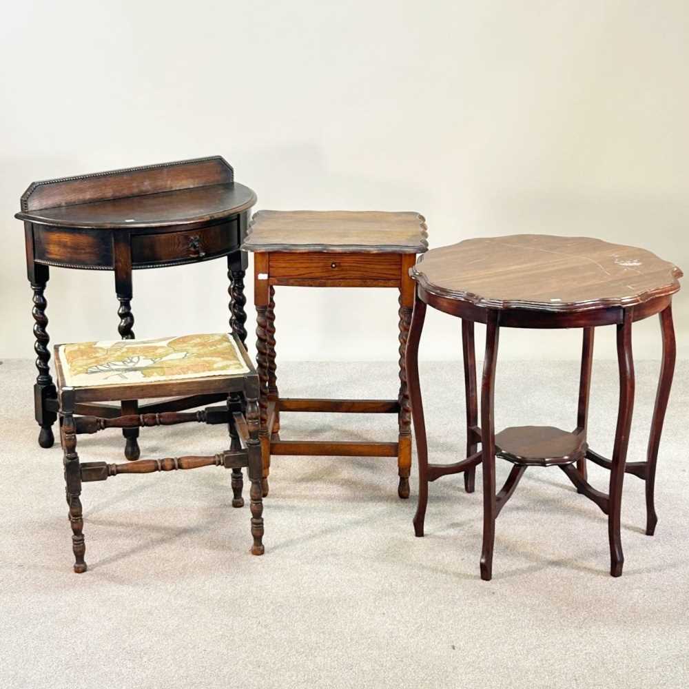 Lot 527 - A 1920s oak half round side table, together