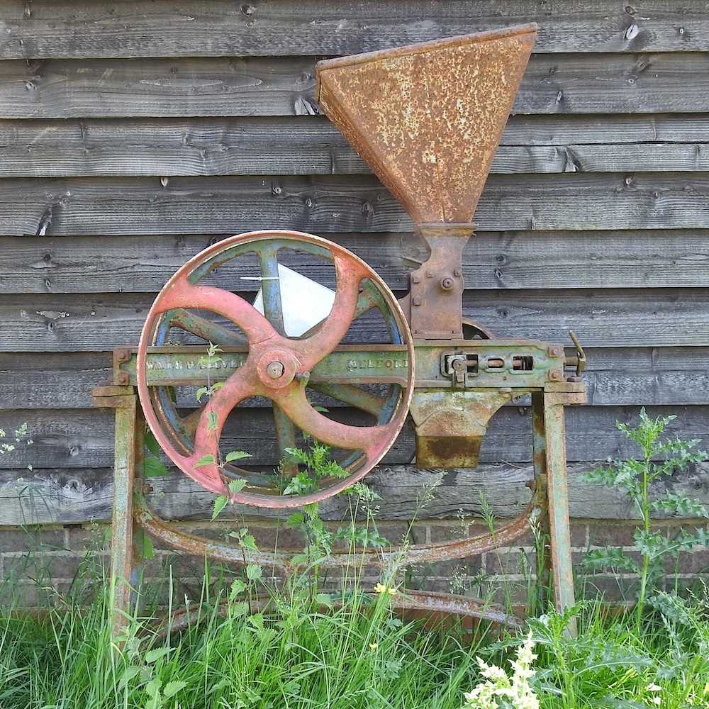 Lot 519 - An antique corn milling machine