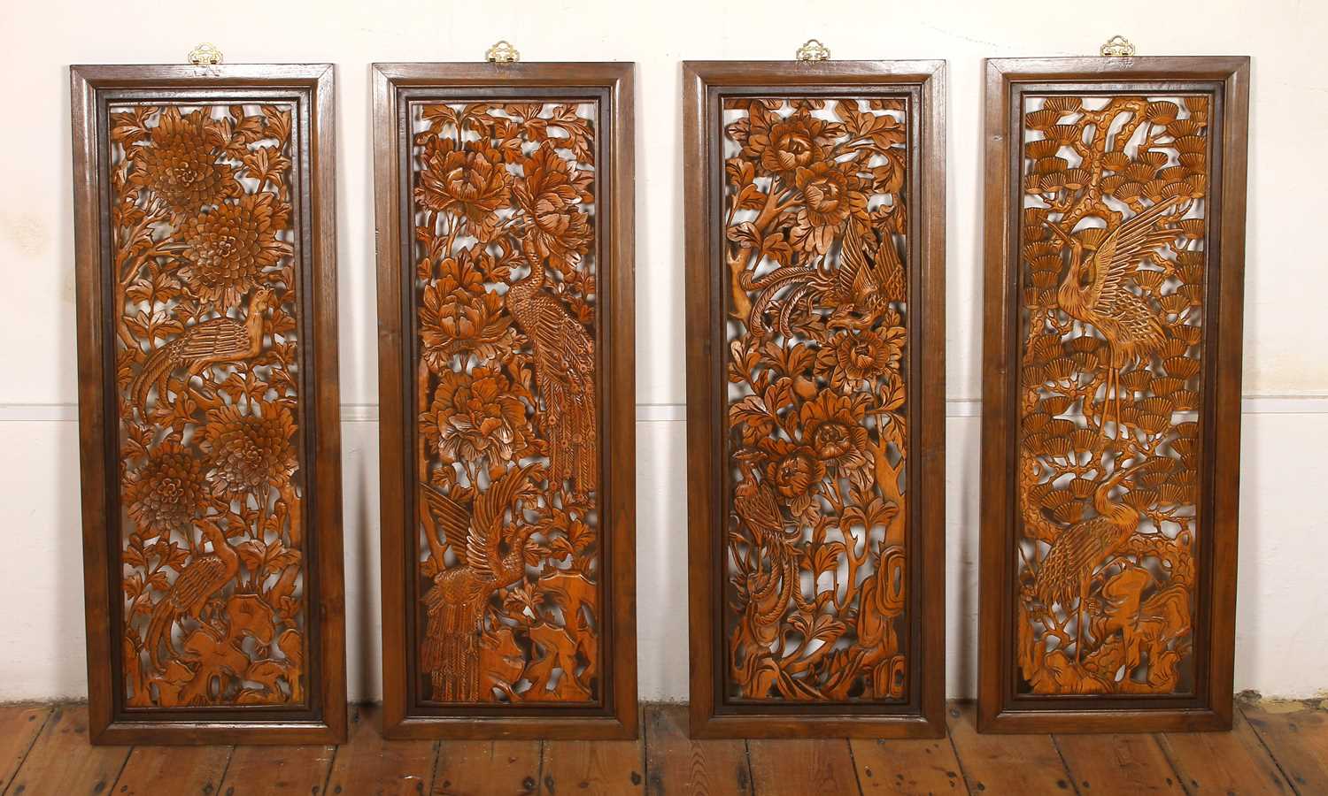 Lot 844 - A set of four Japanese carved wood wall