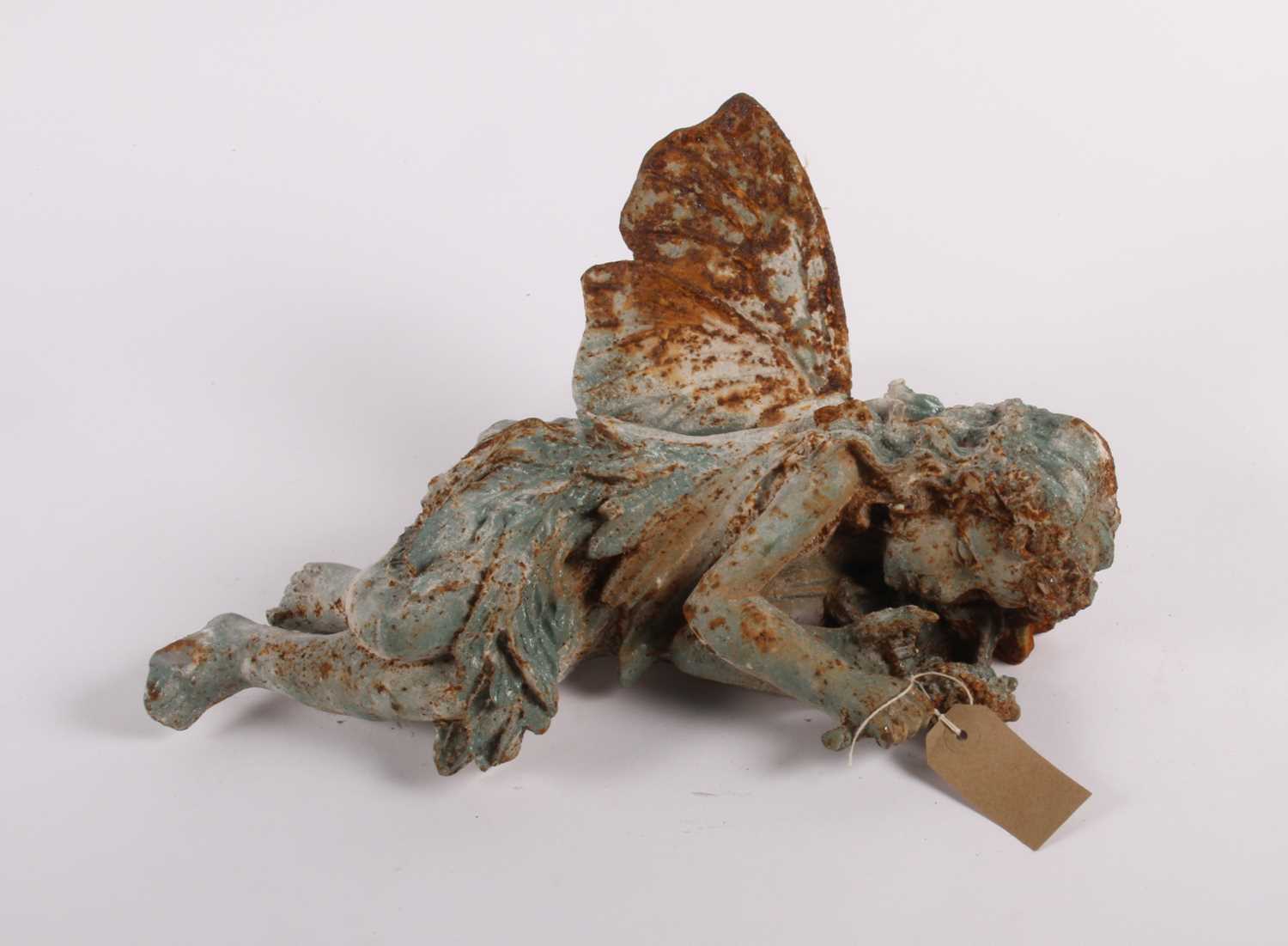 Lot 442 - A verdigris metal model of a sleeping fairy