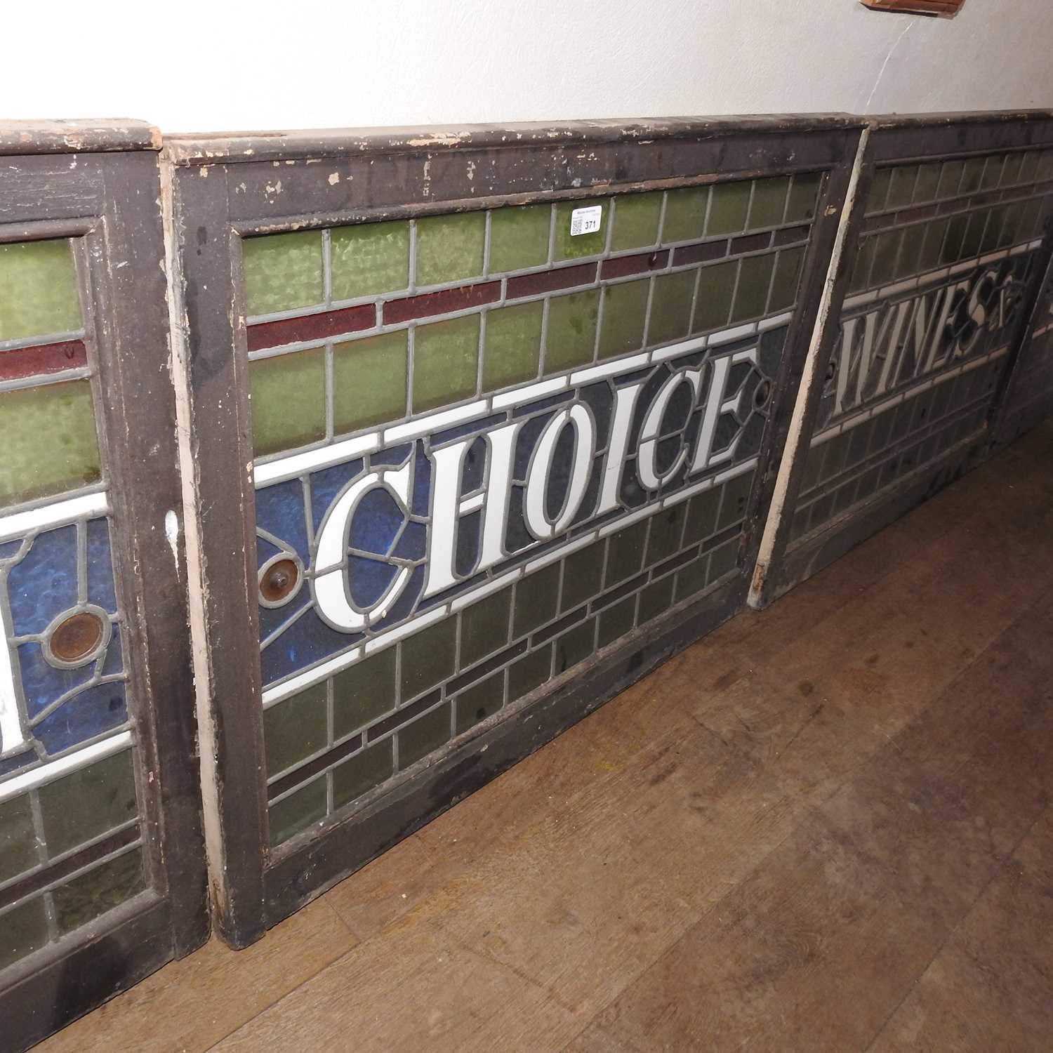Lot 371 - A rare vintage stained glass advertising