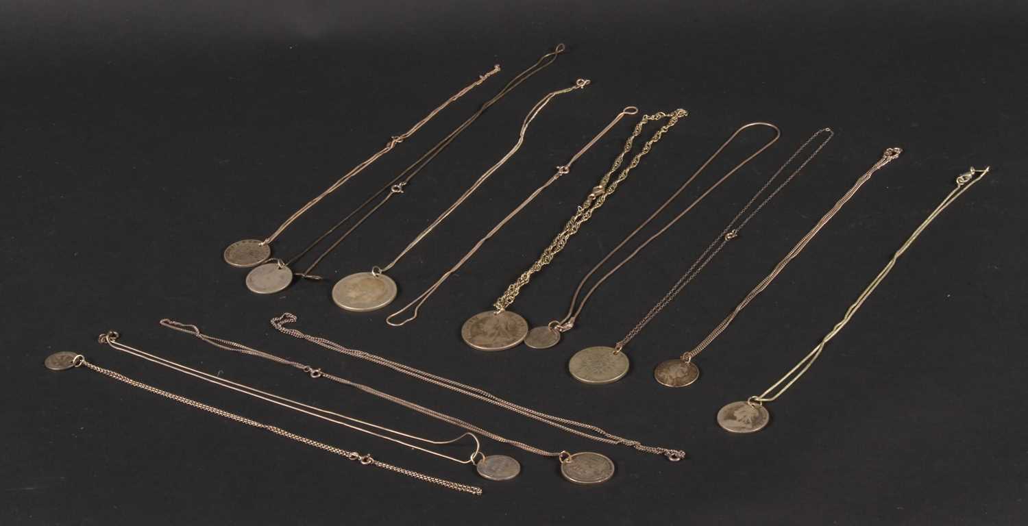 Lot 38 - A collection of coin jewellery, including a