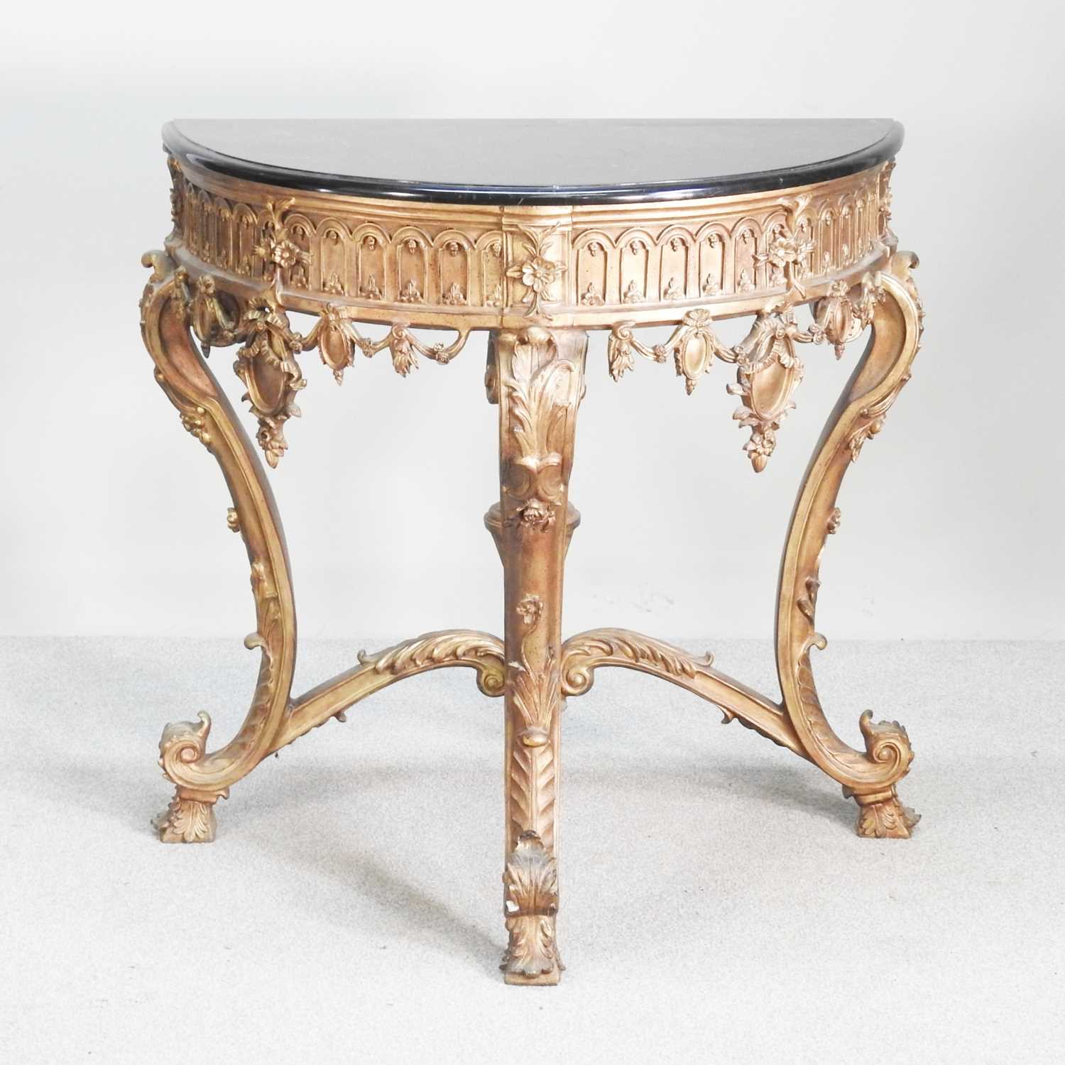 Lot 79 - An ornate continental style gilt console